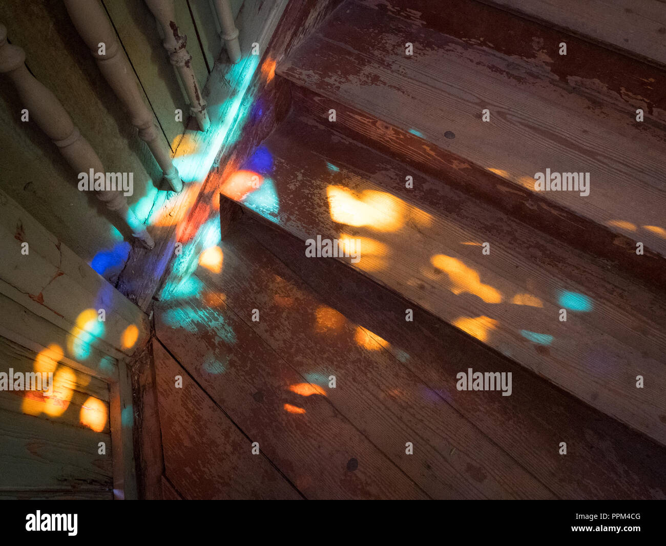 Light refracting through a stained glass window in an apartment ...