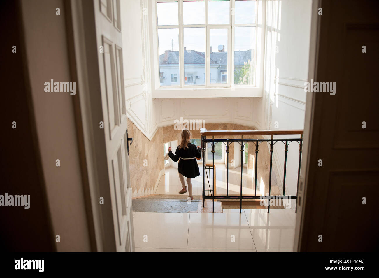 Girl running stairs house hi-res stock photography and images - Alamy