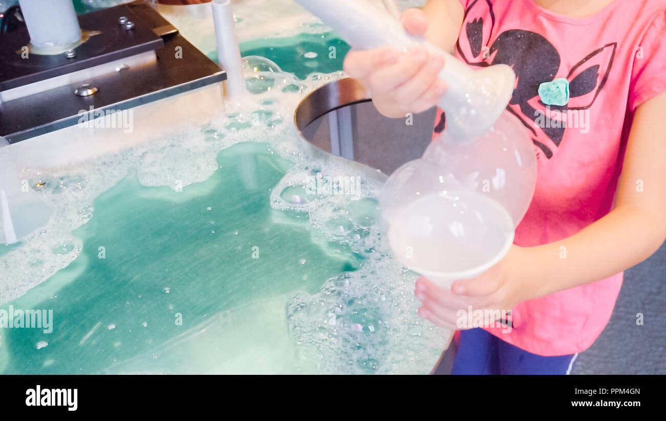 Kids science with bubbles at local science museum Stock Photo - Alamy