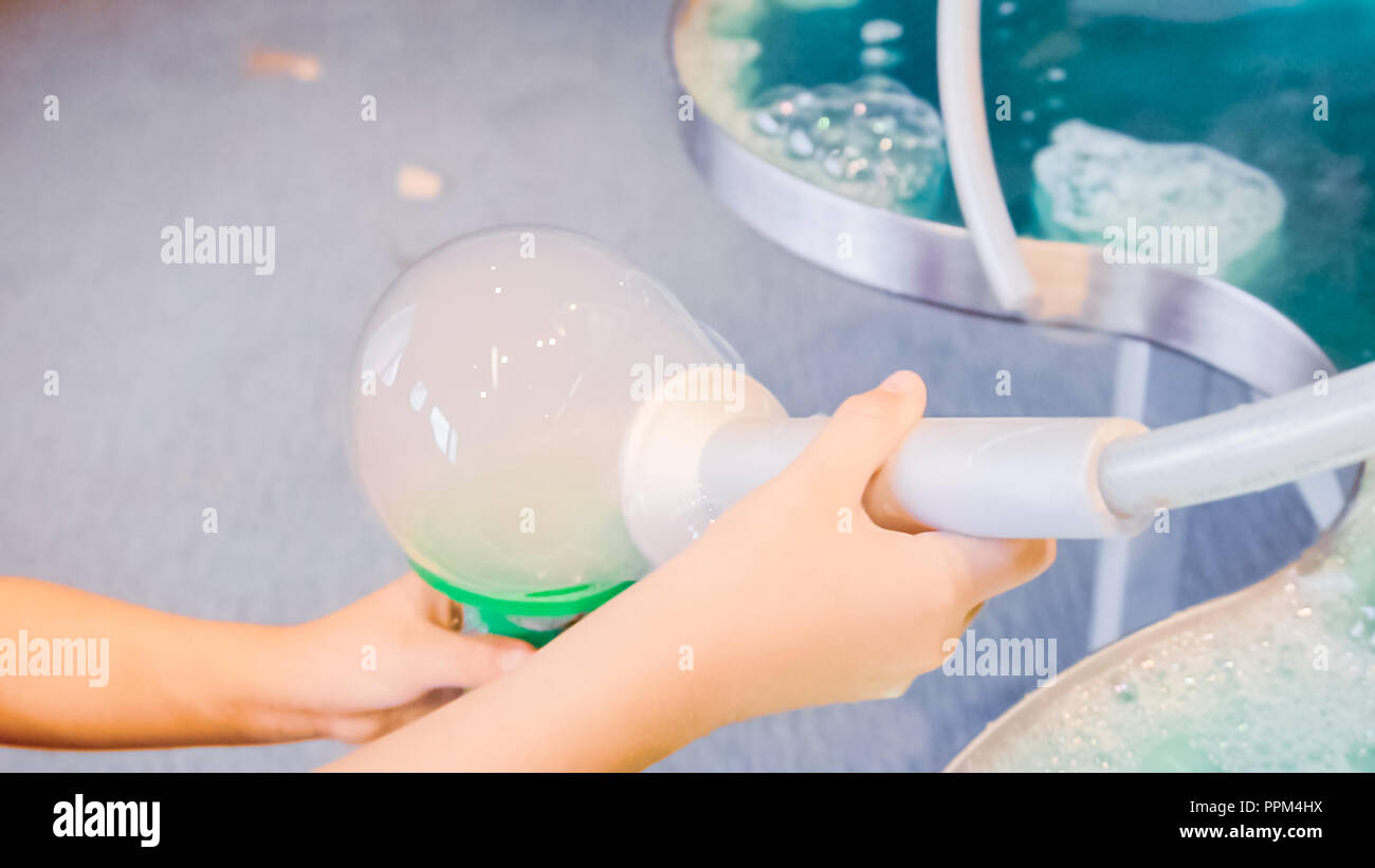 Kids science with bubbles at local science museum Stock Photo - Alamy