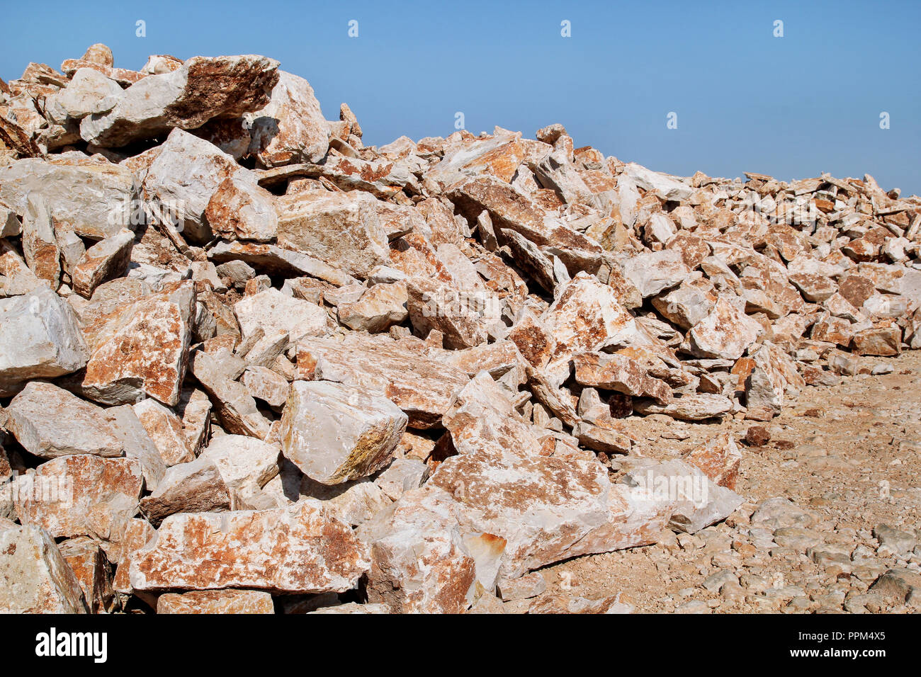 Brown Granite. Big pile of rocks for construction and boulders piled in ...