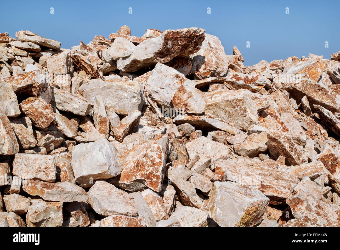 Brown Granite. Big pile of rocks for construction and boulders piled in ...