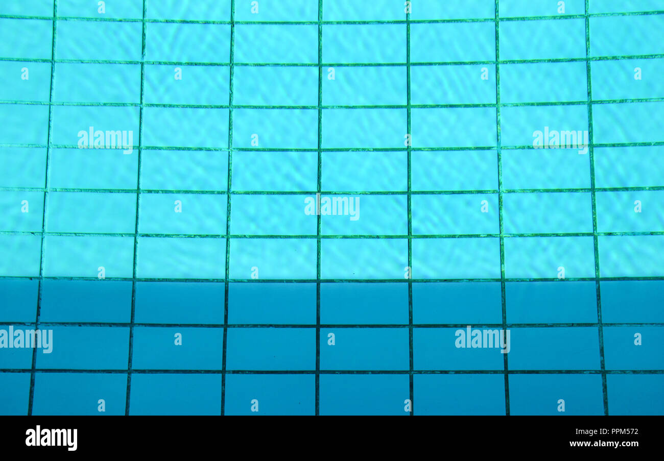 Pattern of sunlight on the bottom of a pool. Poolside pool swimming ...