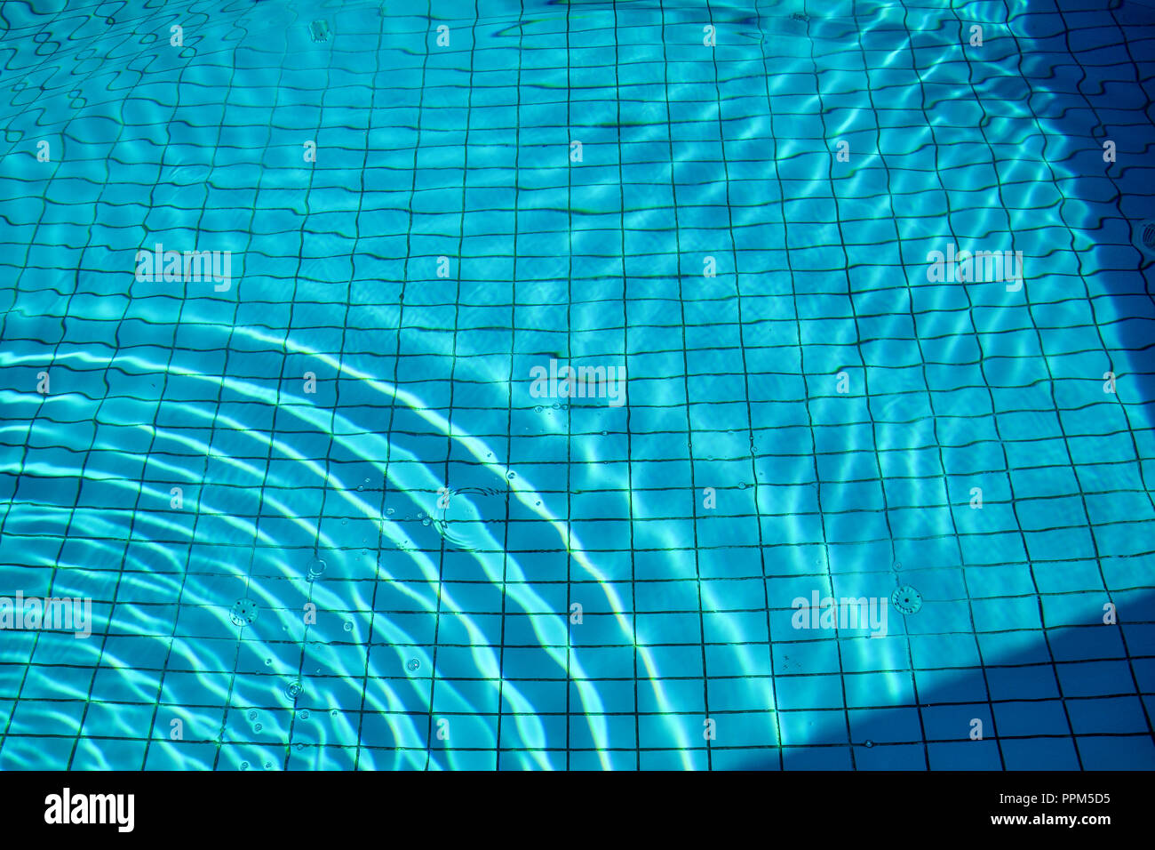 Swimming pool bottom caustics ripple and flow with waves background ...