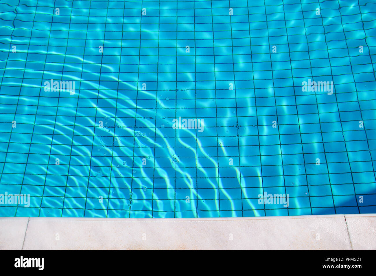 Blue ripped water in swimming pool. Swimming pool bottom caustics ...