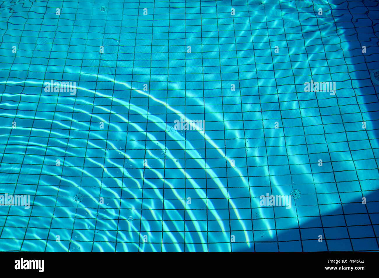 Swimming pool bottom caustics ripple and flow with waves background ...