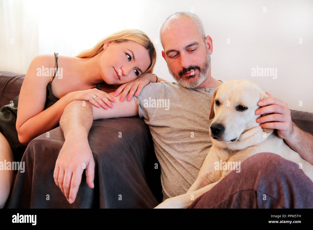 People couple with dog at home. Lovers happy and cute handsome couple ...