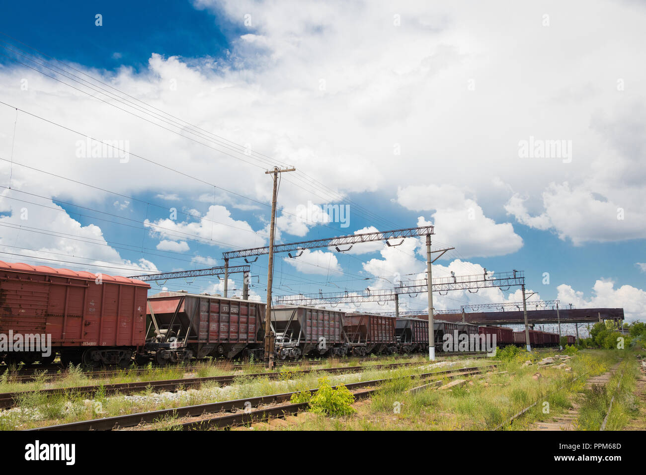 Trains with freight cars and freight cars stand on the railway side ...