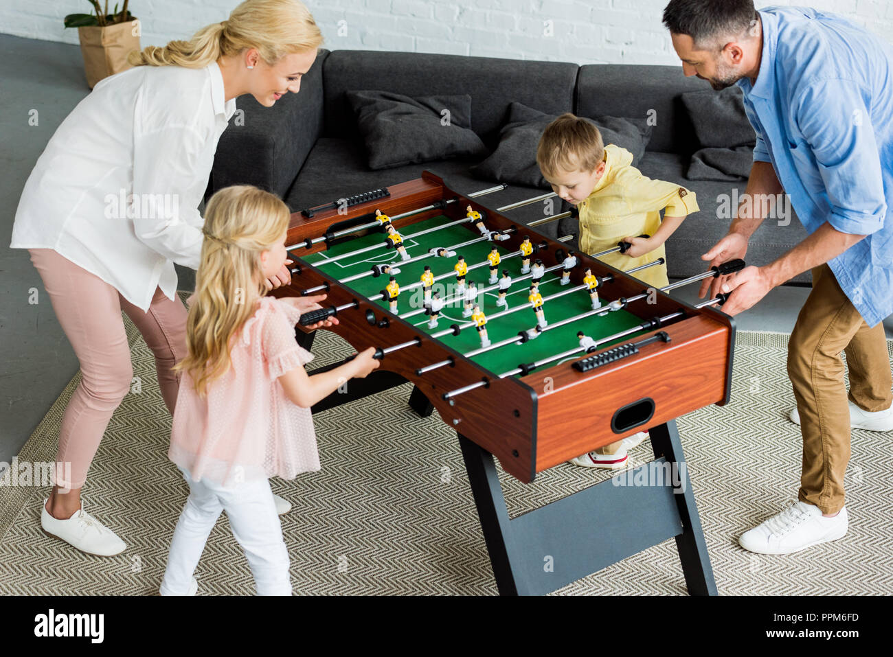 Father kids playing football together hi-res stock photography and ...