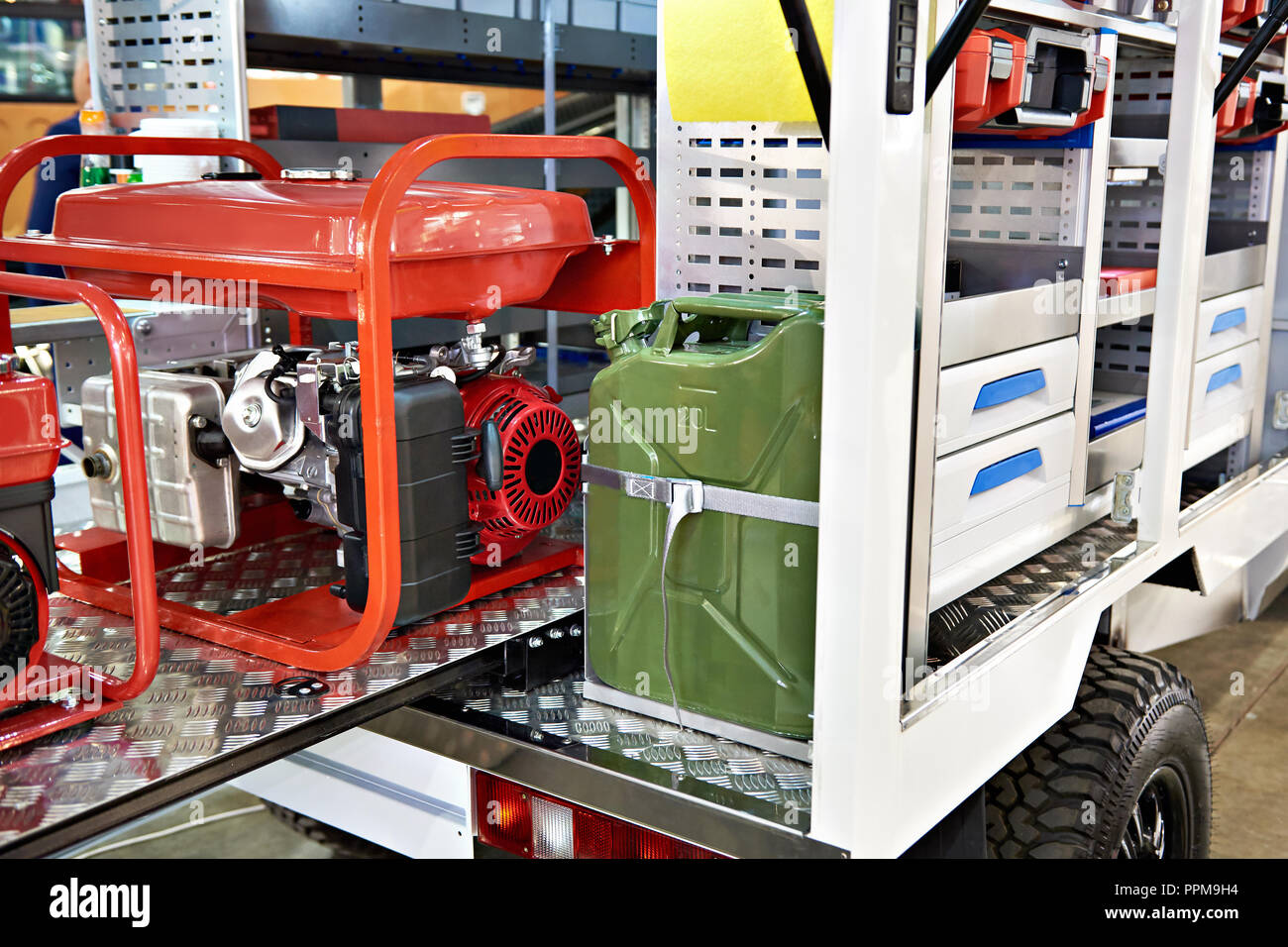 Gasoline generator and canister with fuel in car support Stock Photo ...
