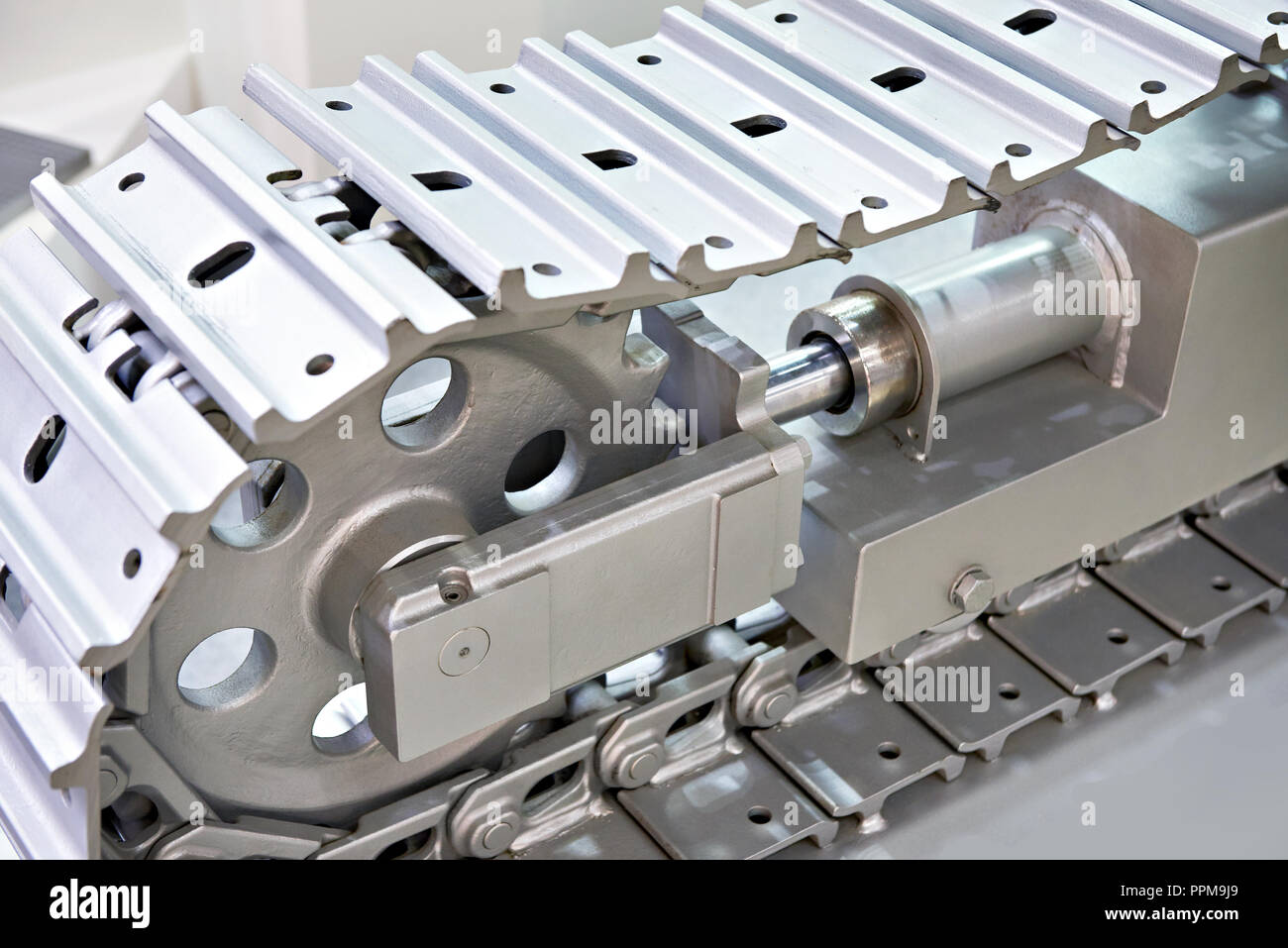 Track caterpillar and drive wheel of tractor Stock Photo - Alamy