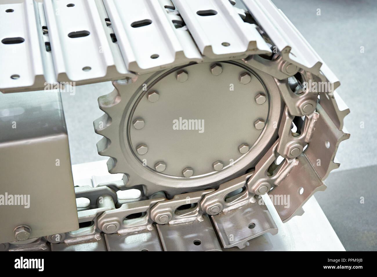 Track caterpillar and drive wheel of tractor Stock Photo - Alamy