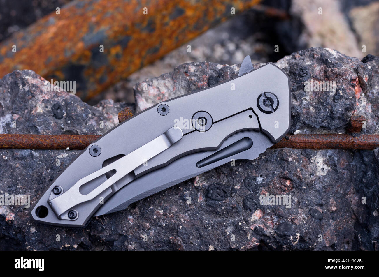 Knife with titanium handle. Knife with a clip. The knife is in the ...