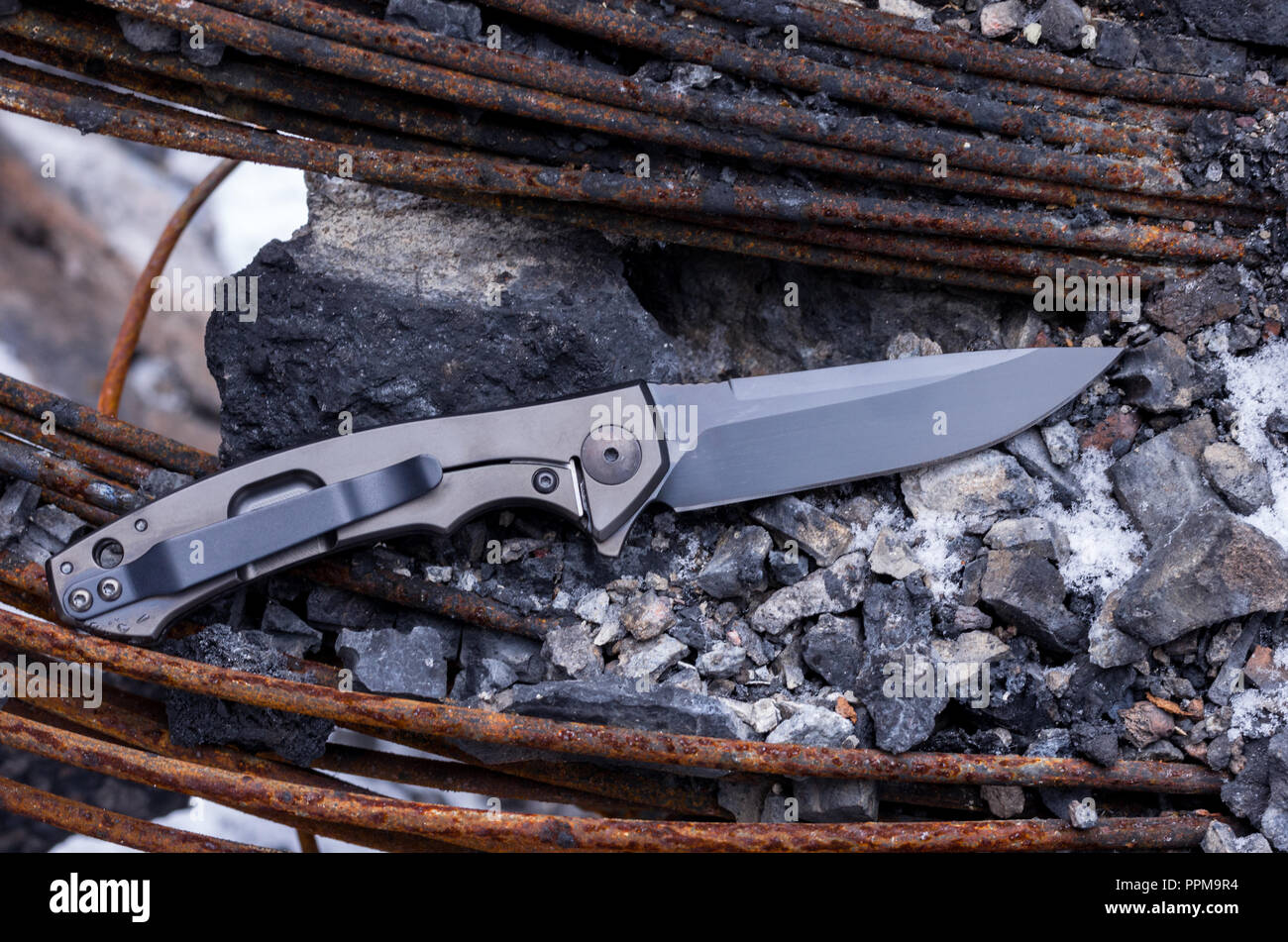 Black knife and handle of titanium. Fron view Stock Photo - Alamy