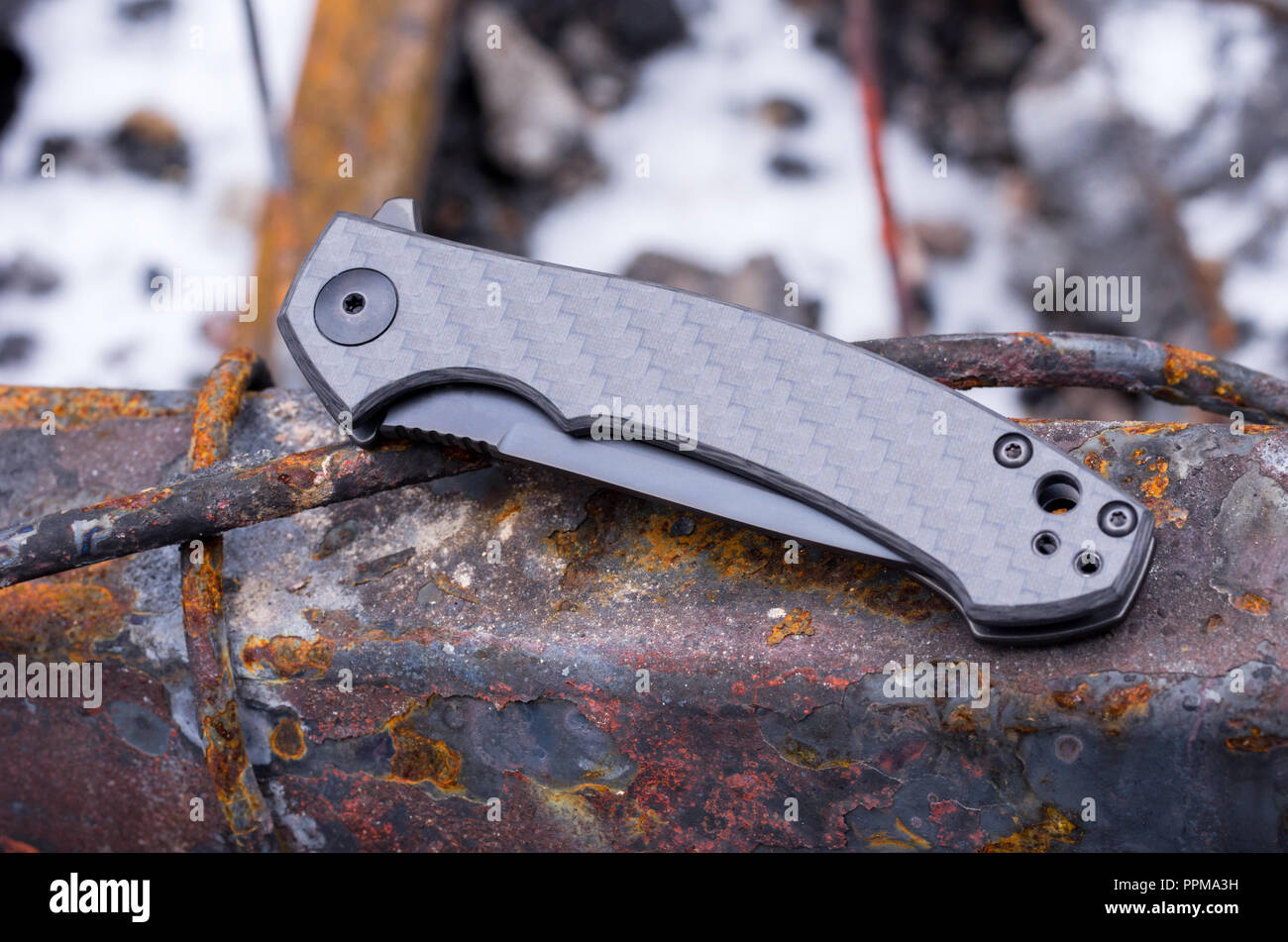 A small pocket knife. The knife on the rusty iron. Top Stock Photo - Alamy