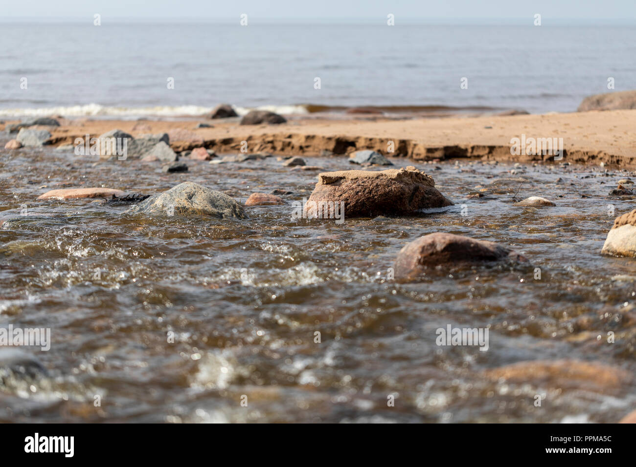 A stream of water flowing into the Baltic Sea Stock Photo - Alamy