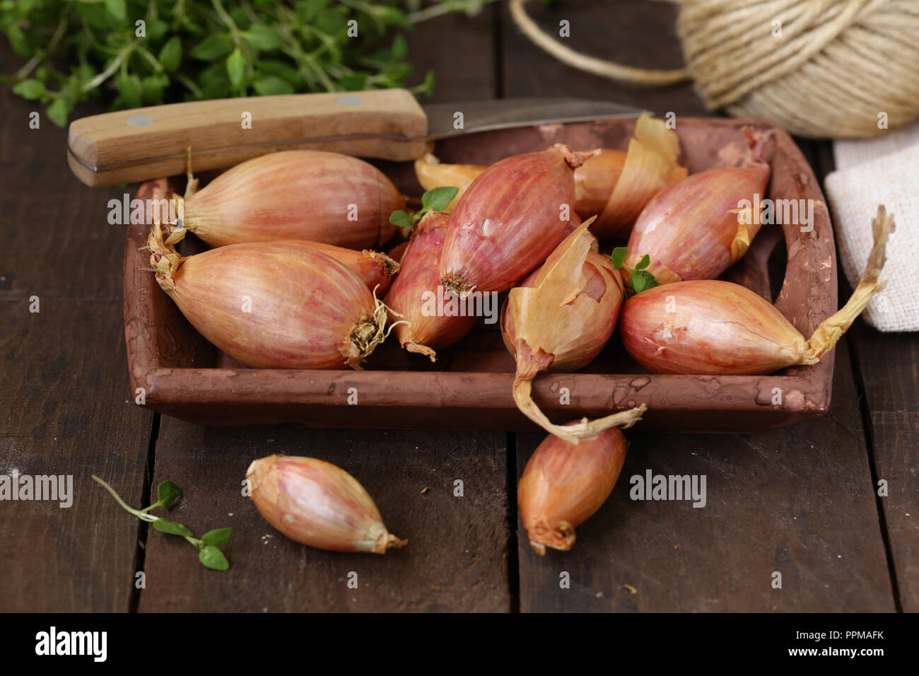 organic shallots on a wooden table, rustic style Stock Photo - Alamy