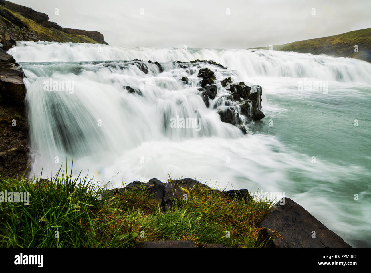 A waterfall in a beautiful Iceland landscape Stock Photo - Alamy