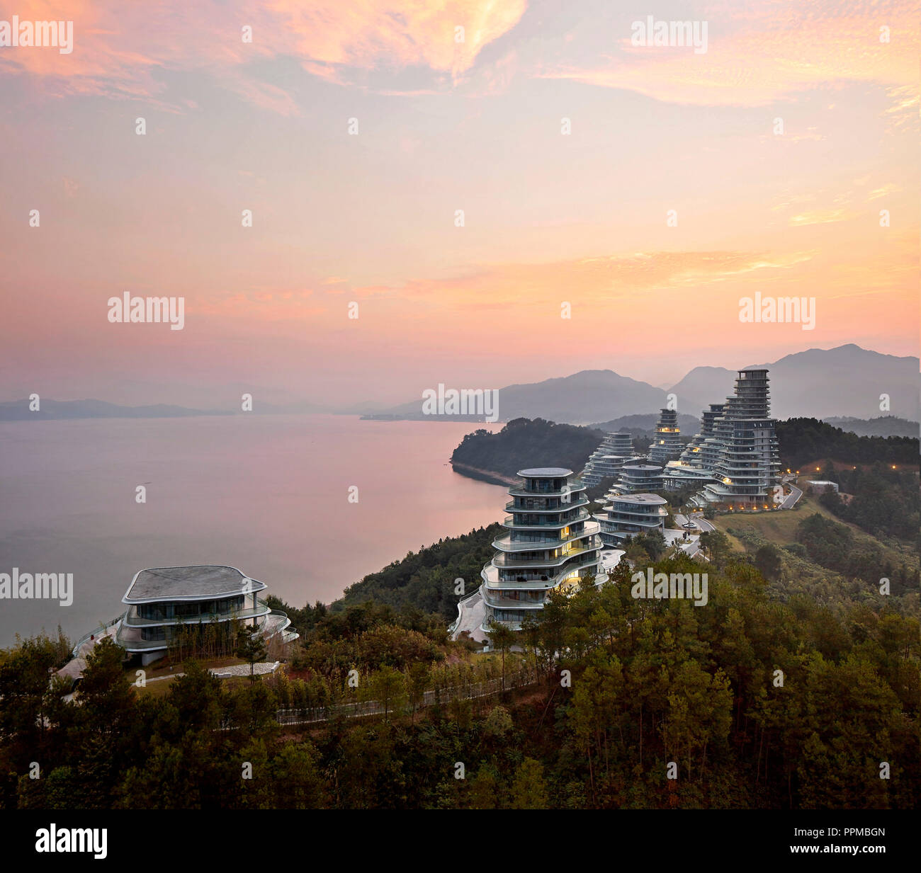 Elevated sunset view of housing clusters on hillside with Taiping Lake ...