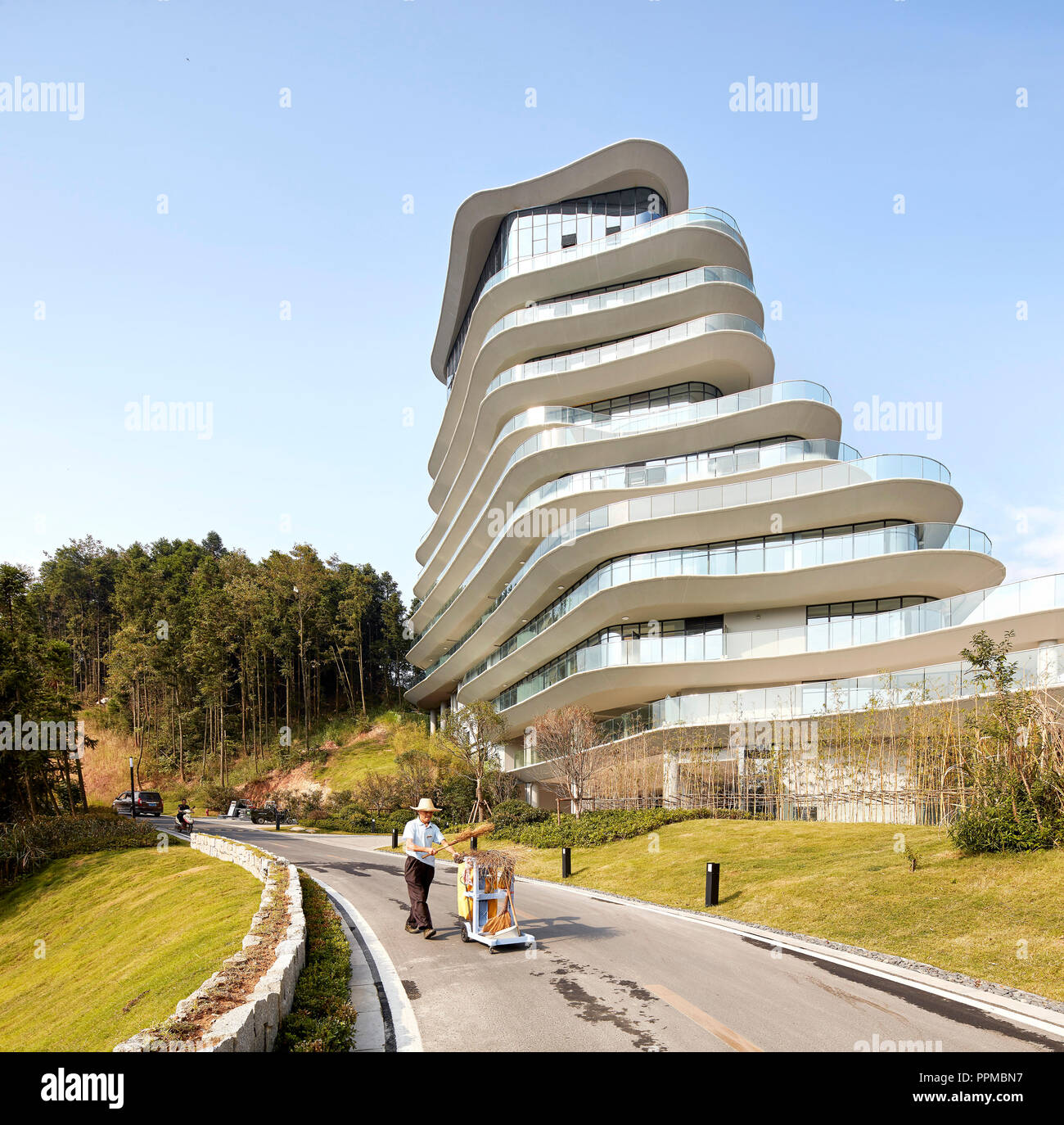 Street scene and exterior facade of multi-level building. Huangshan ...