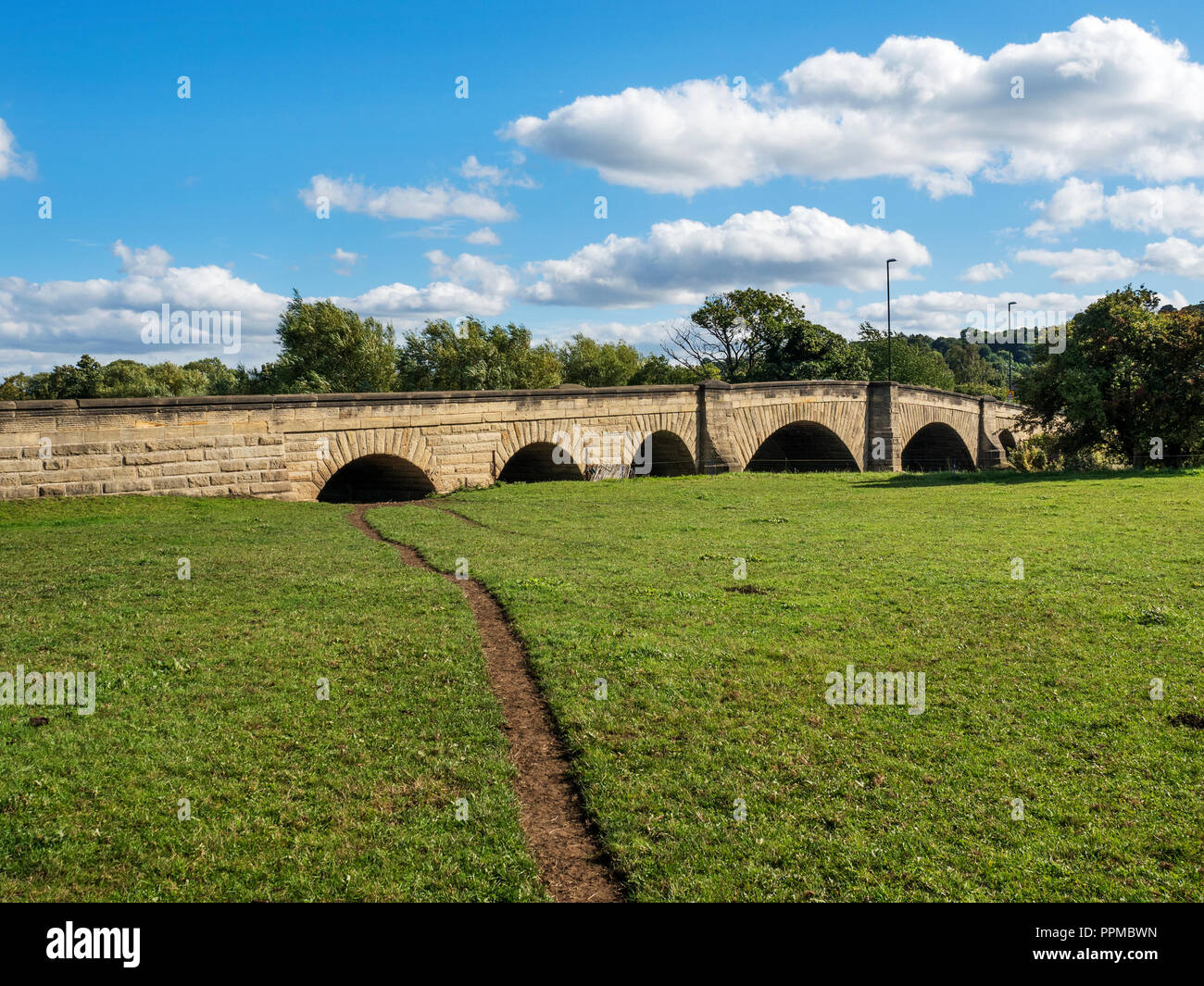 Footpath across a field to Pool Bridge over the River Wharfe at Pool in ...