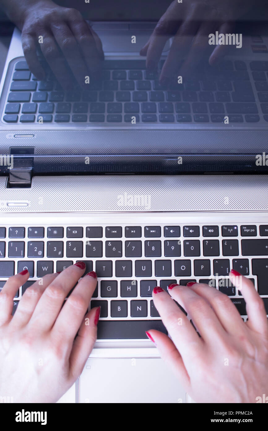 Secretary typist typing on laptop pc computer keyboard keys with hands ...