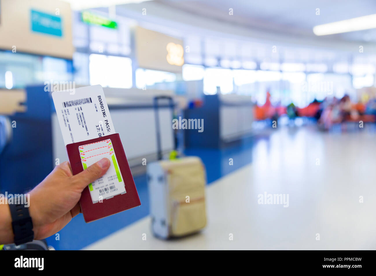 Passport with boarding pass at departure terminal gate in airport Stock ...