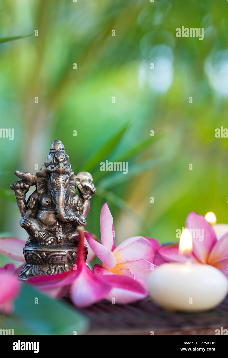 Statue of Ganesha Indian Hinduism God of wisdom and prosperity and heap ...