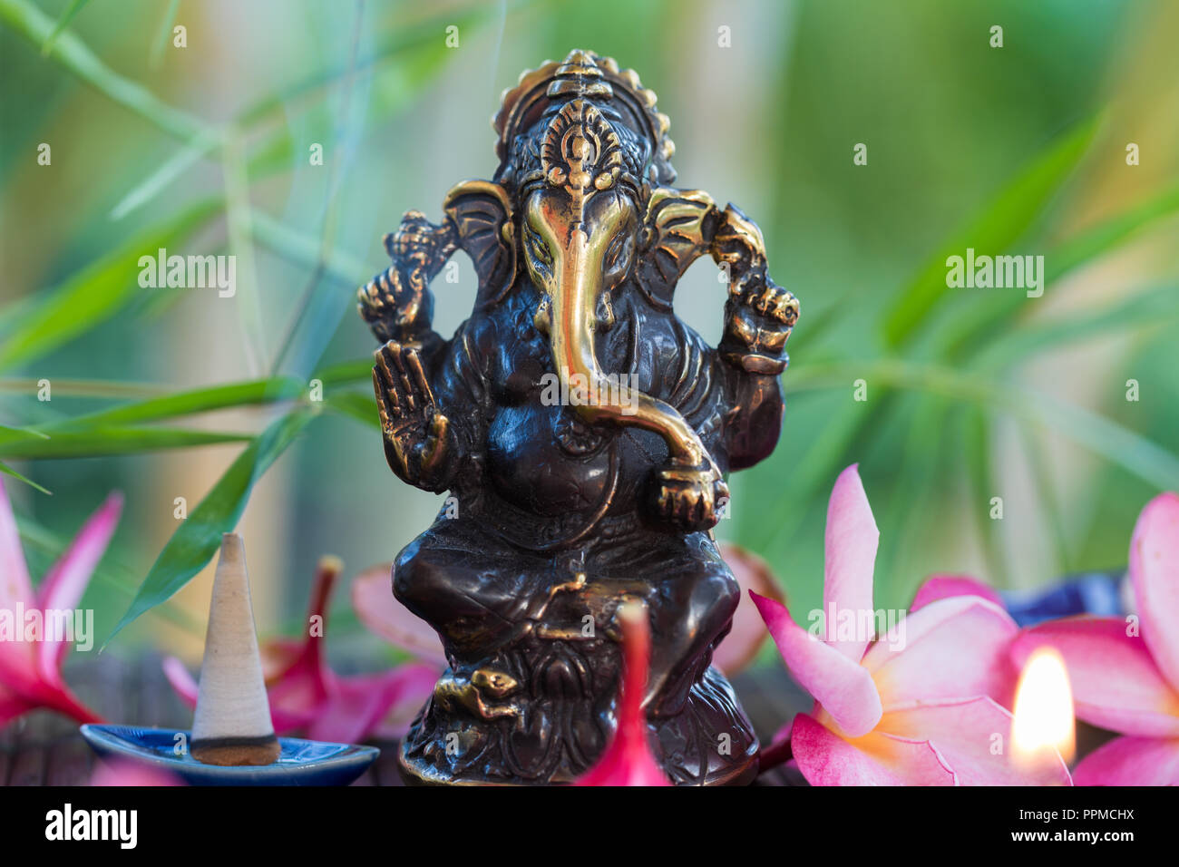 Statue of Ganesha Indian Hinduism God of wisdom and prosperity and heap ...