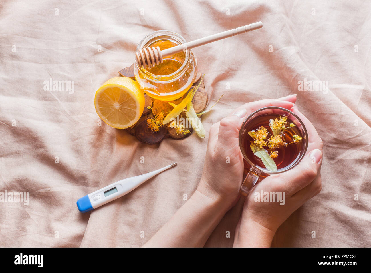 Tea with Linden, honey and Lemon. The tray on the bed, the Concept of ...