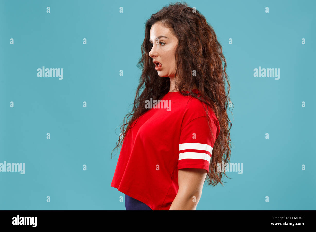 Horrible, stress, shock. Female half-length portrait isolated at blue ...