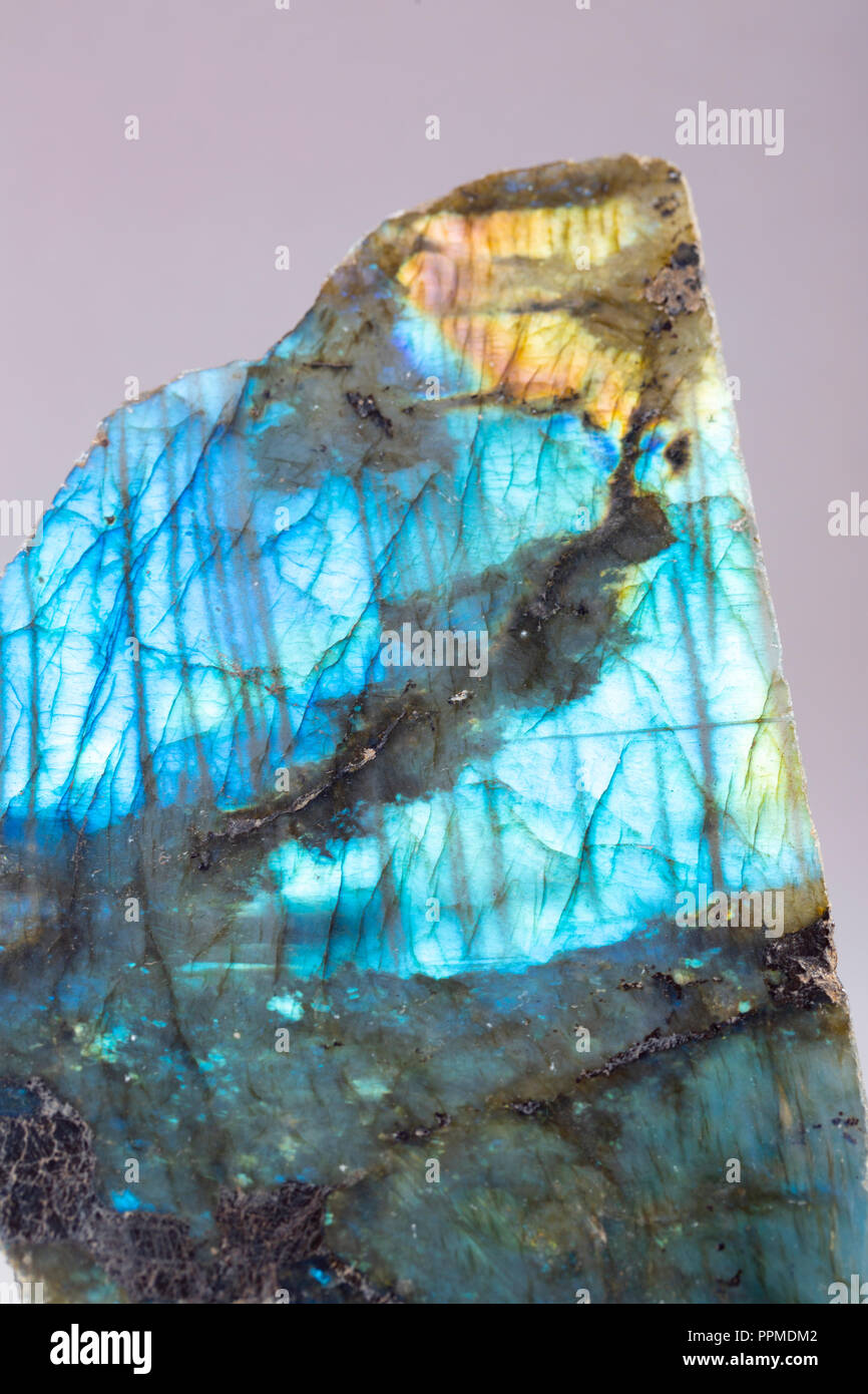 One polished labradorite gemstone isolated on white background close-up ...