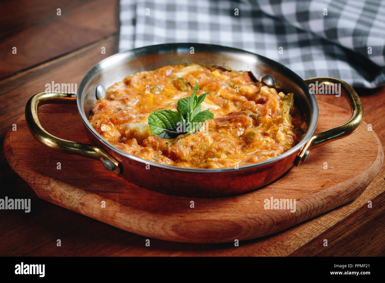 Traditional turkish food menemen made by eggs and tomatoes Stock Photo ...