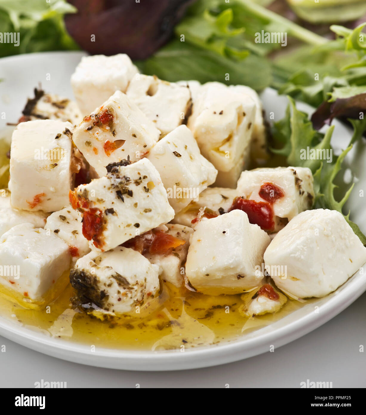 Feta Cheese With Olive Oil And Herbs,close up Stock Photo - Alamy