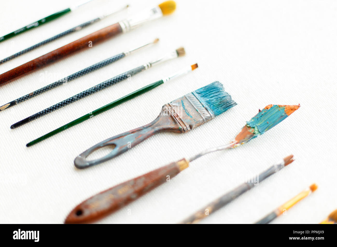 Old brushes and tools of the artist on a white background. Artist Set ...
