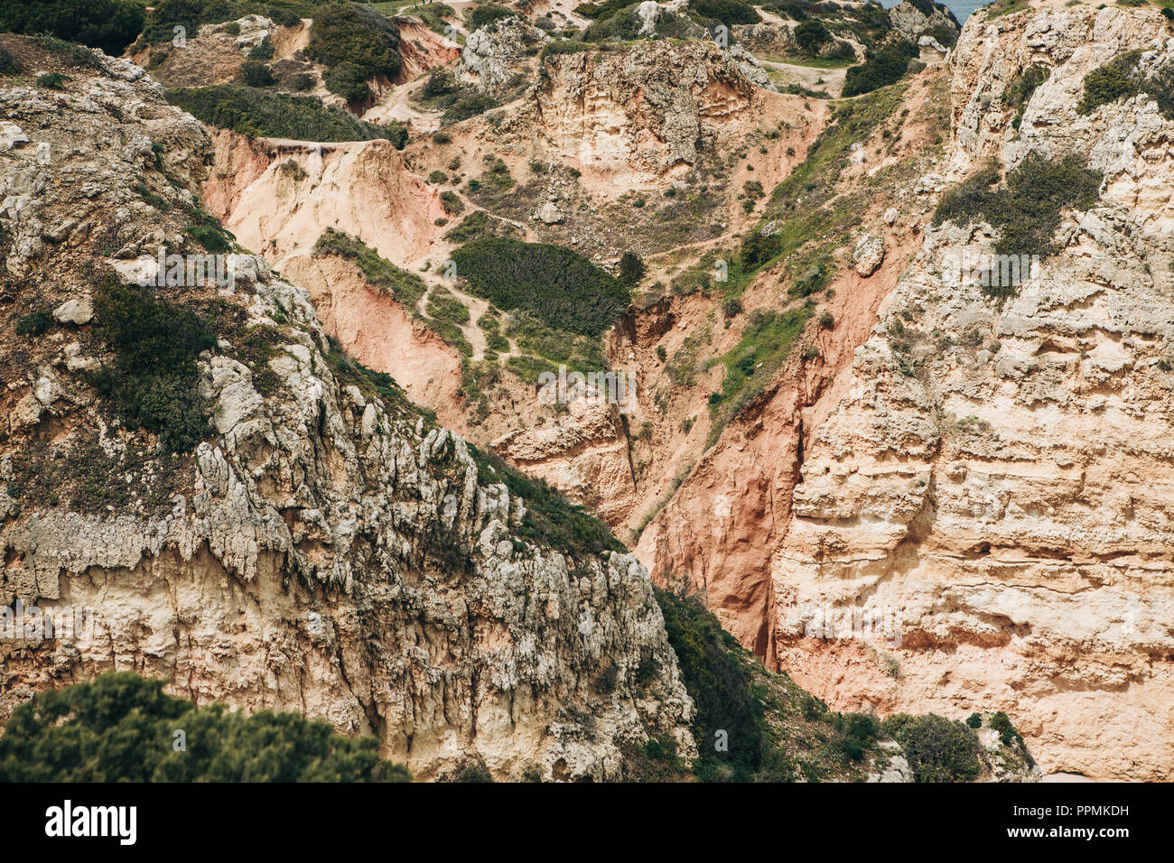 Sandstone limestone rocks of reddish color in Portugal Stock Photo - Alamy