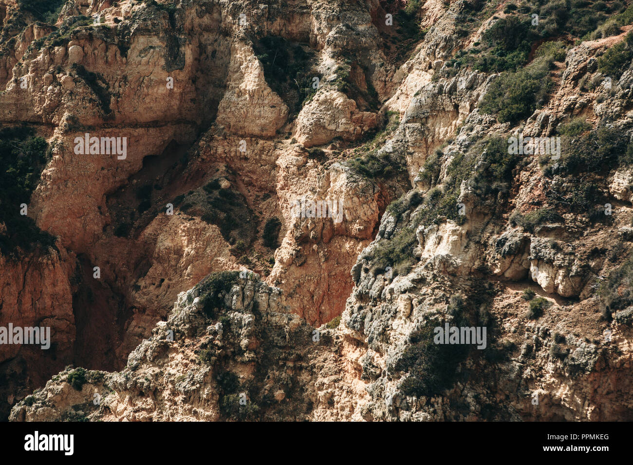 Sandstone limestone rocks of reddish color in Portugal Stock Photo - Alamy