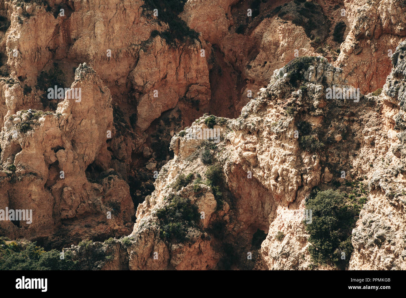 Sandstone limestone rocks of reddish color in Portugal Stock Photo - Alamy