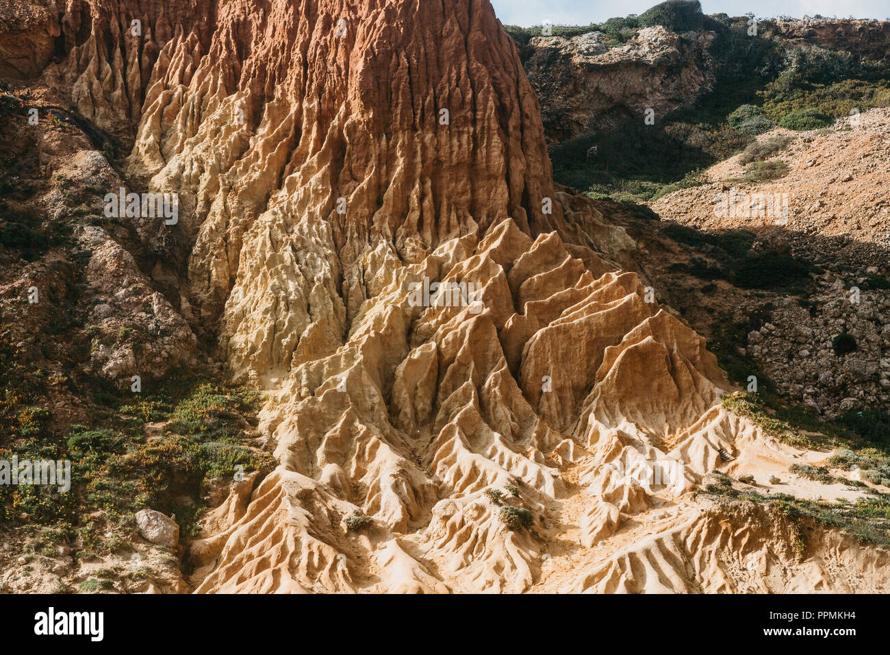 Sandstone limestone rocks of reddish color in Portugal Stock Photo - Alamy