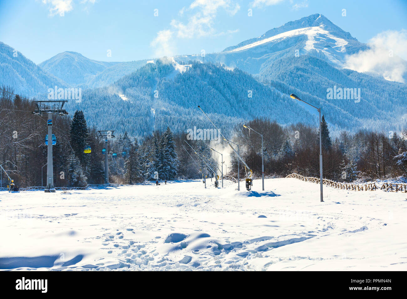 Winter ski resort background with white snow mountain peak, slopes, ski ...