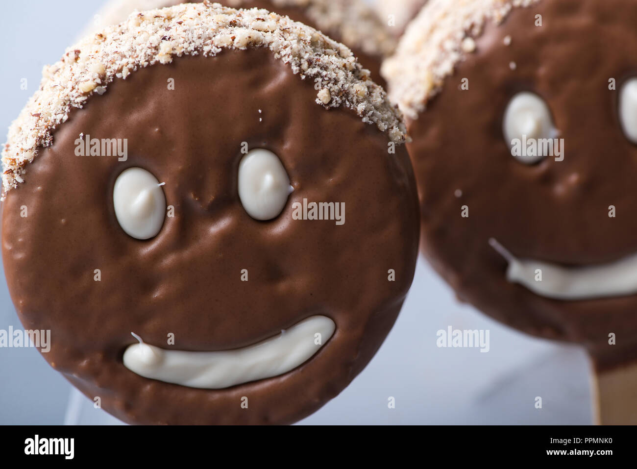 chocolate face shape smiley face cookie Stock Photo - Alamy