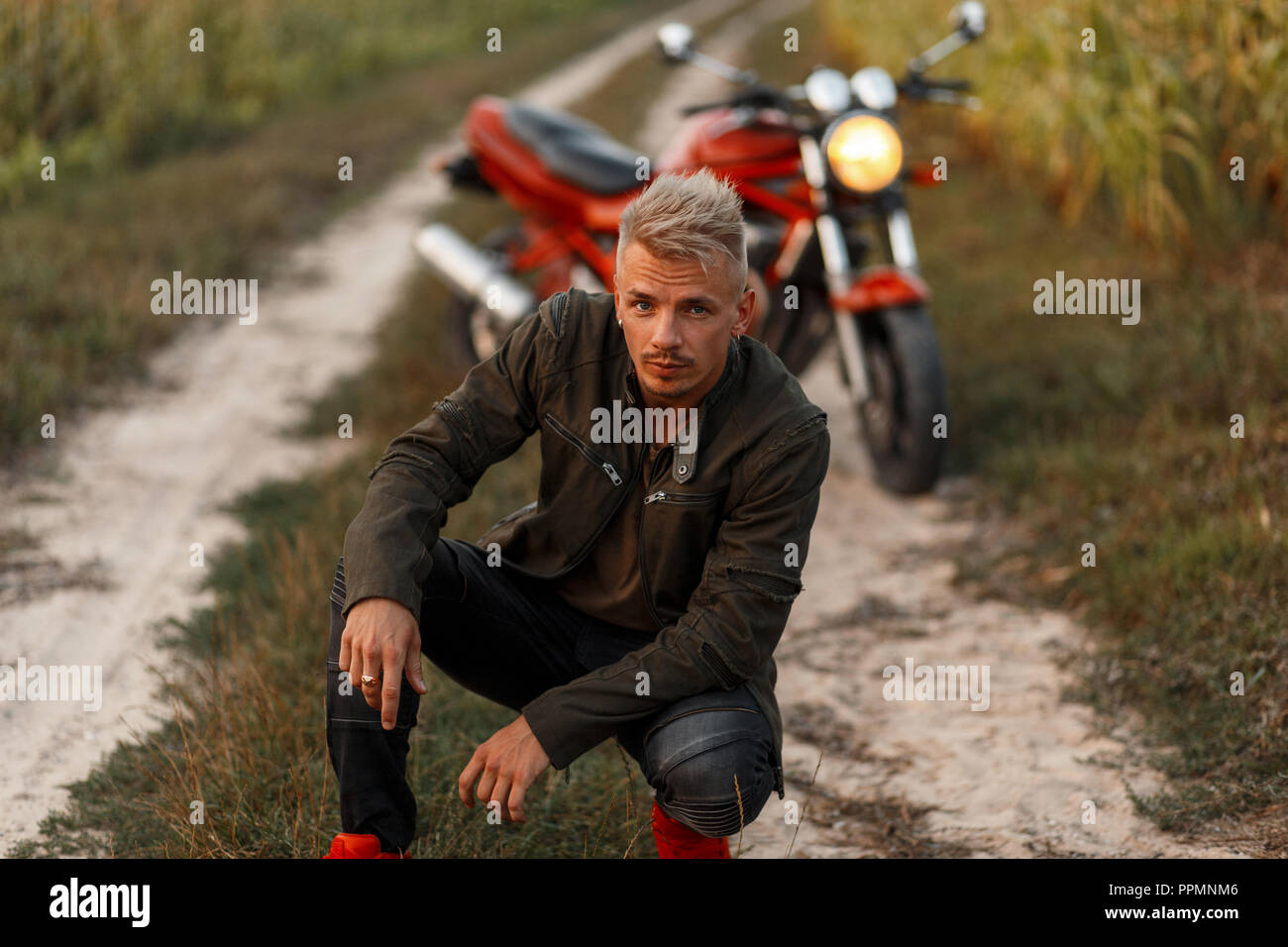 Man black hair on a motorcycle hi-res stock photography and images - Alamy