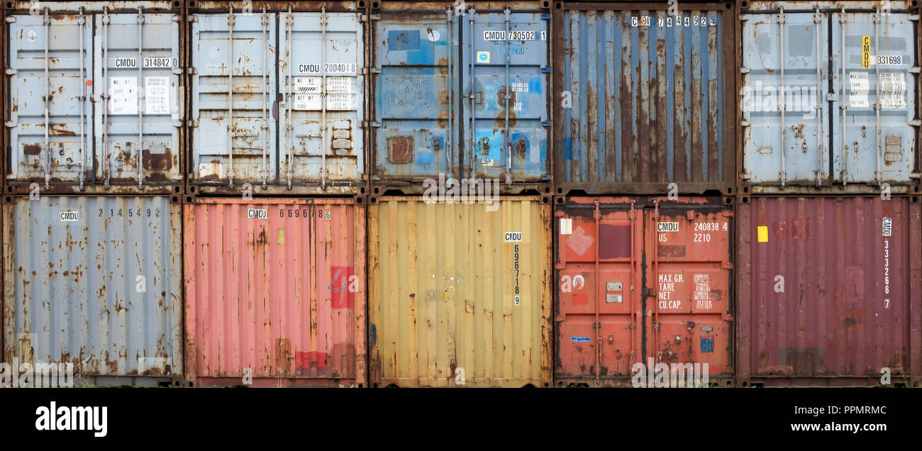 Stack of colorful and rusty containers Stock Photo - Alamy