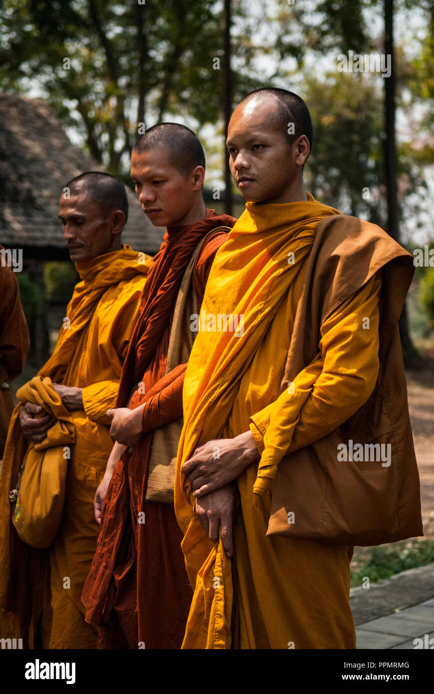 Buddhist monks standing near Wang Pho railway station, Thailand Stock ...
