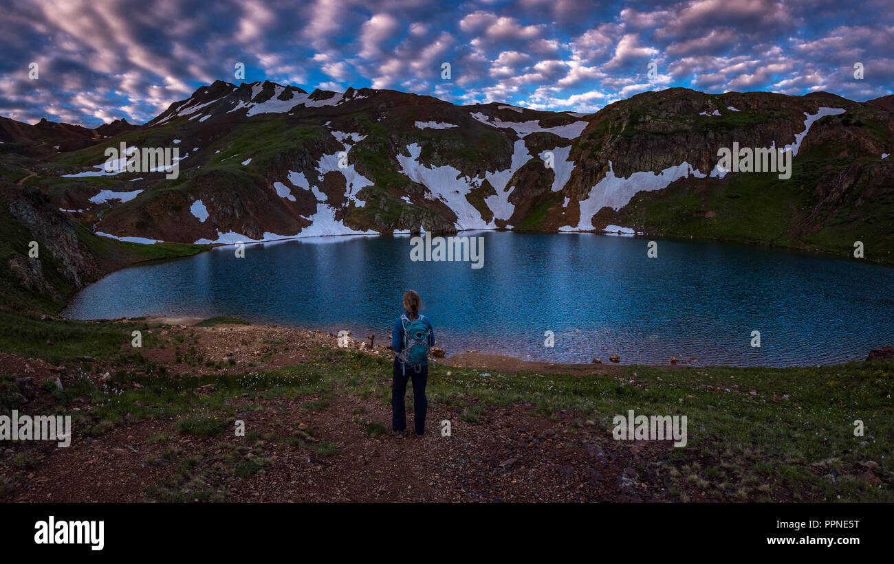 Backpacker Girl looks at Lake Como Colorado USA Stock Photo - Alamy