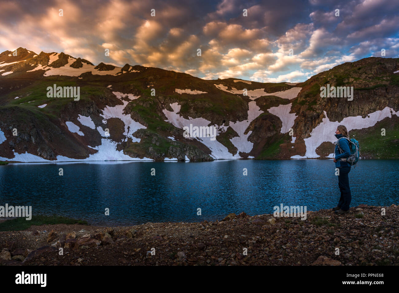 Backpacker Girl looks at Lake Como Colorado USA Stock Photo - Alamy