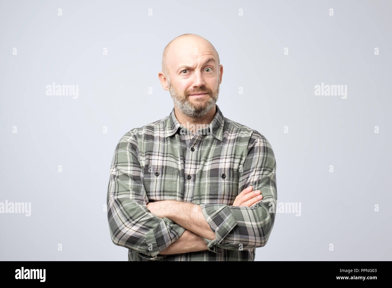 Grumpy man folded arms hi-res stock photography and images - Alamy