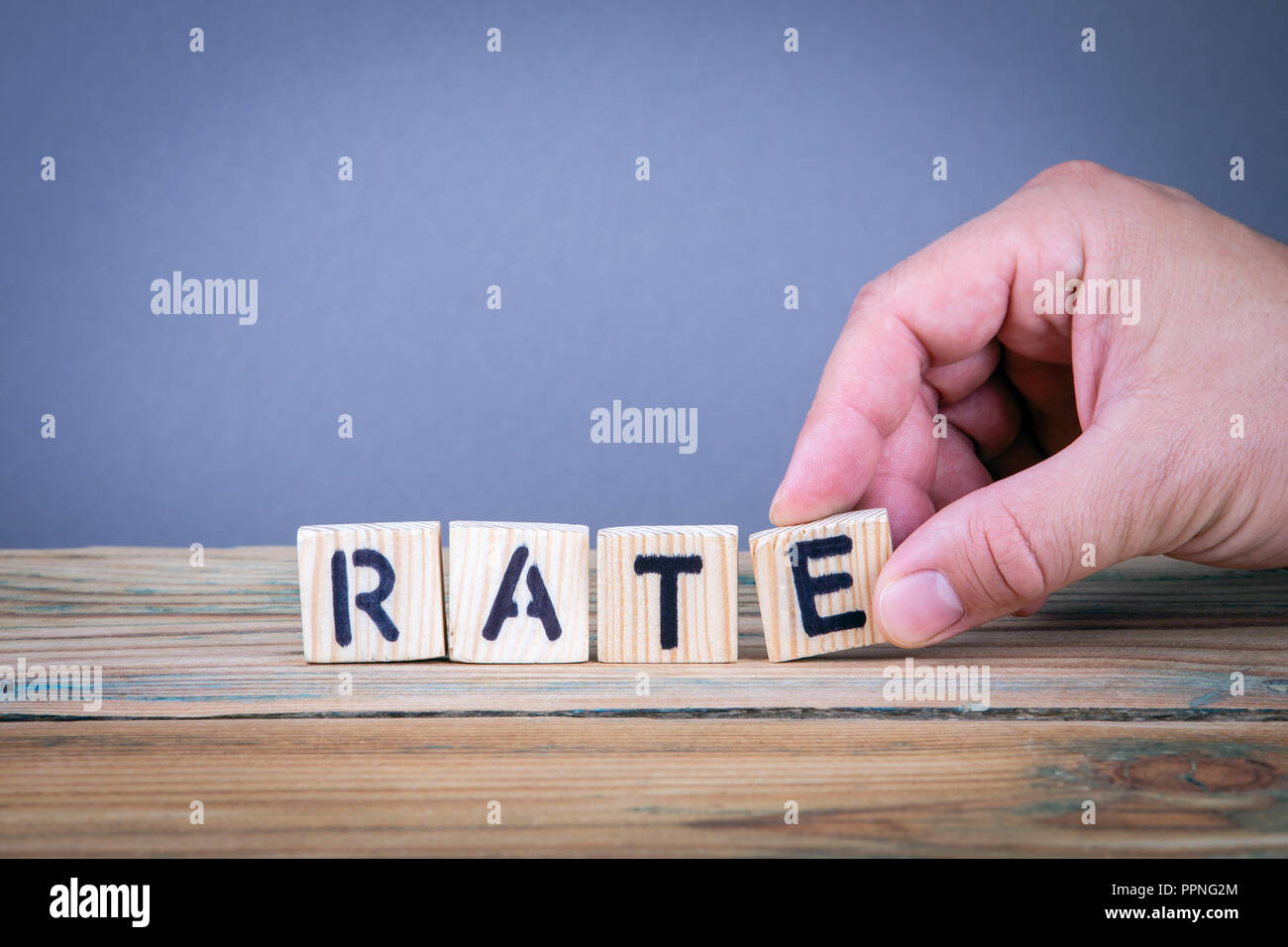 rate. Wooden letters on the office desk Stock Photo - Alamy