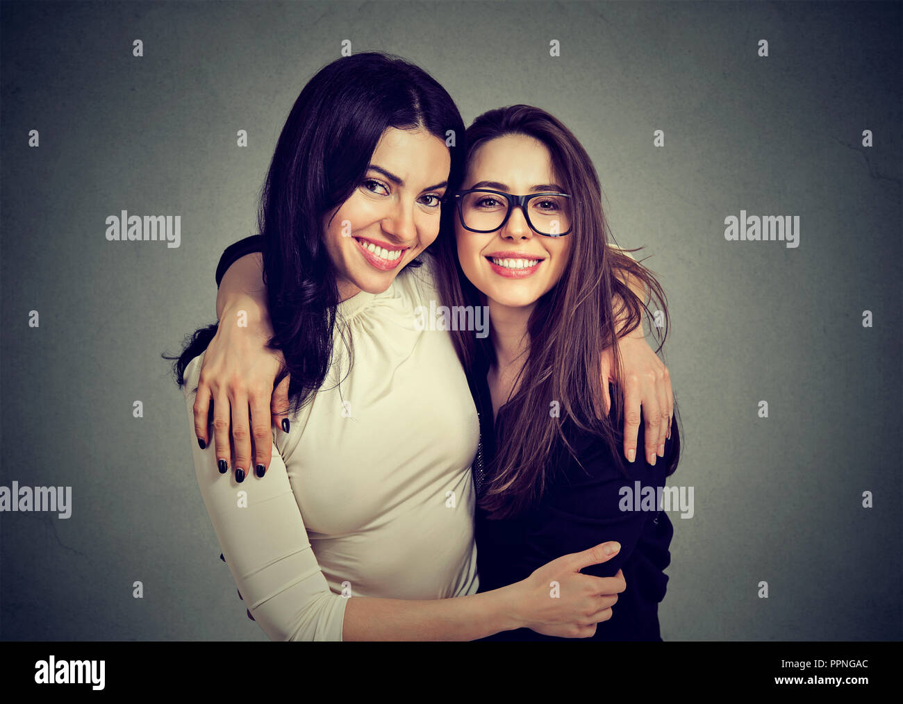 Women hugging friends female hi-res stock photography and images - Alamy