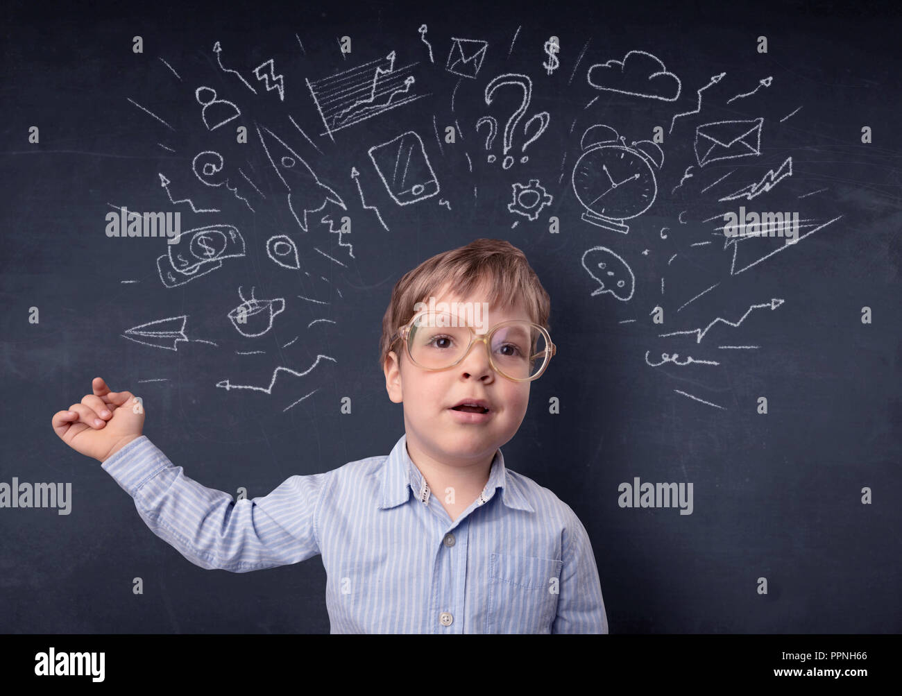 Smart little kid in front of a drawn up blackboard ruminate Stock Photo ...